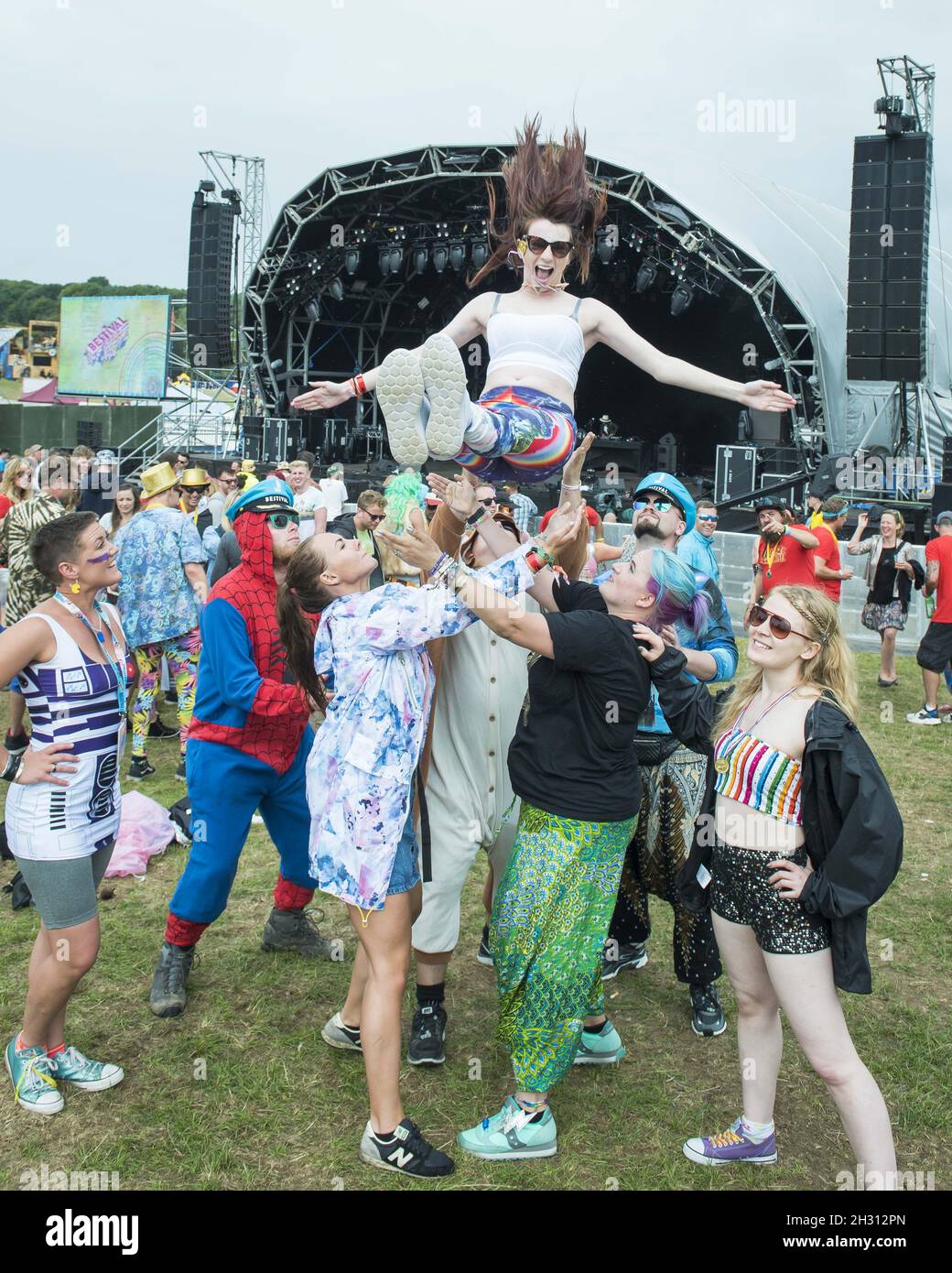 Festival goer is lifted above her friends in the main stage arena on ...
