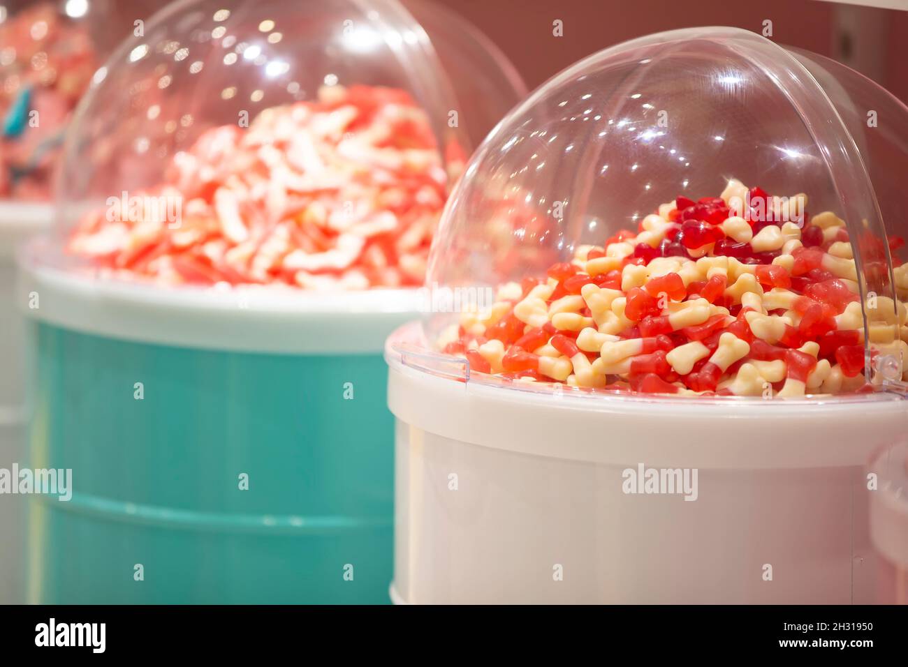 Jelly candies in containers in a store. Large selection of sweets in ...