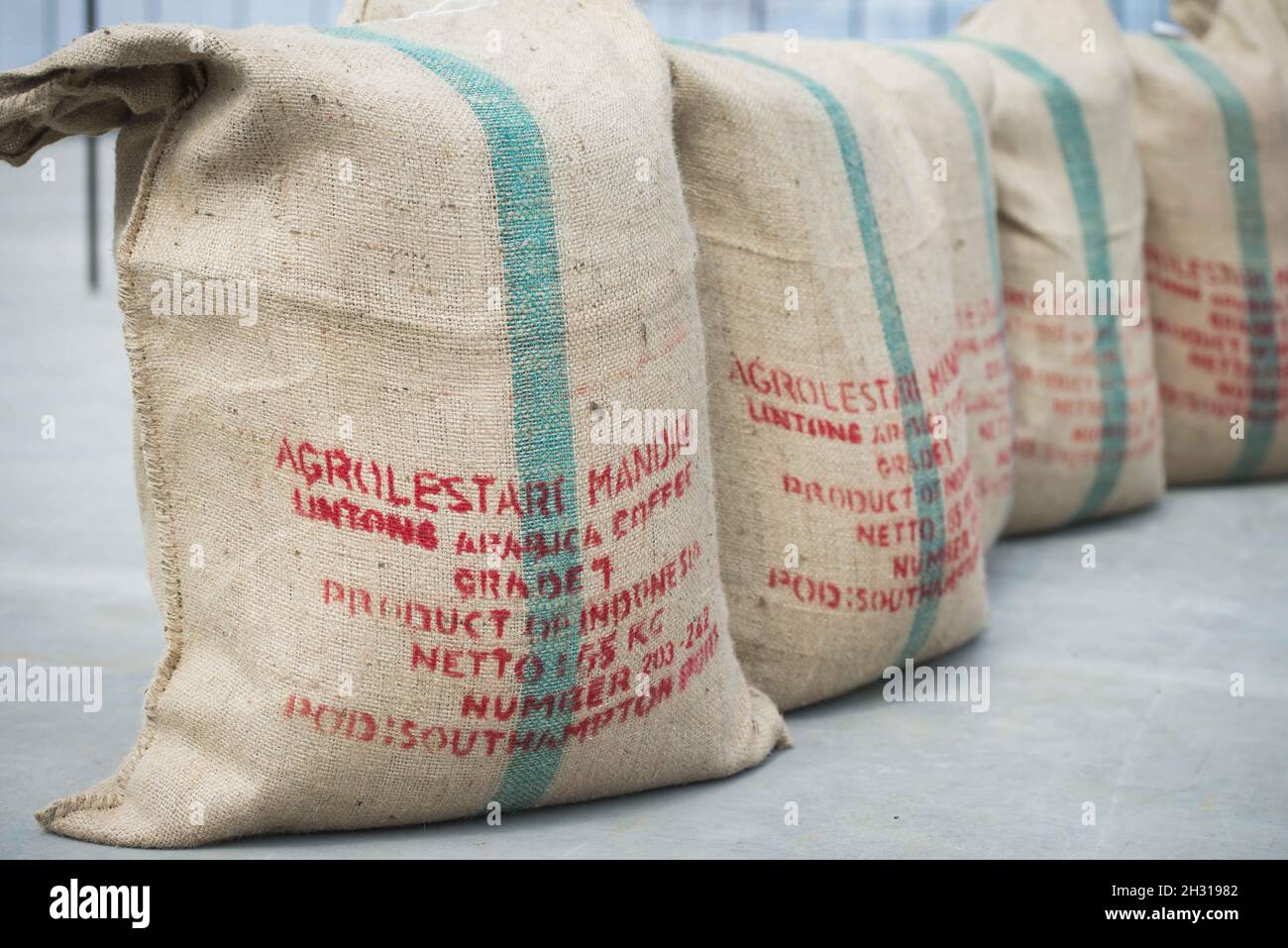 Sacks of coffee at a coffee plantation in Sumatra, Indonesia. Picture ...
