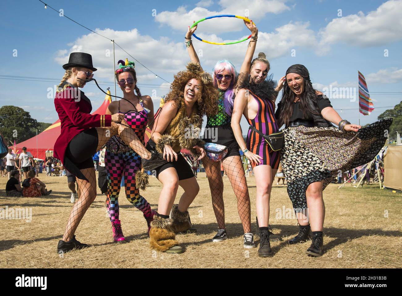 Festival goers wearing Circus fancy dress at Bestival 2018 Lulworth ...