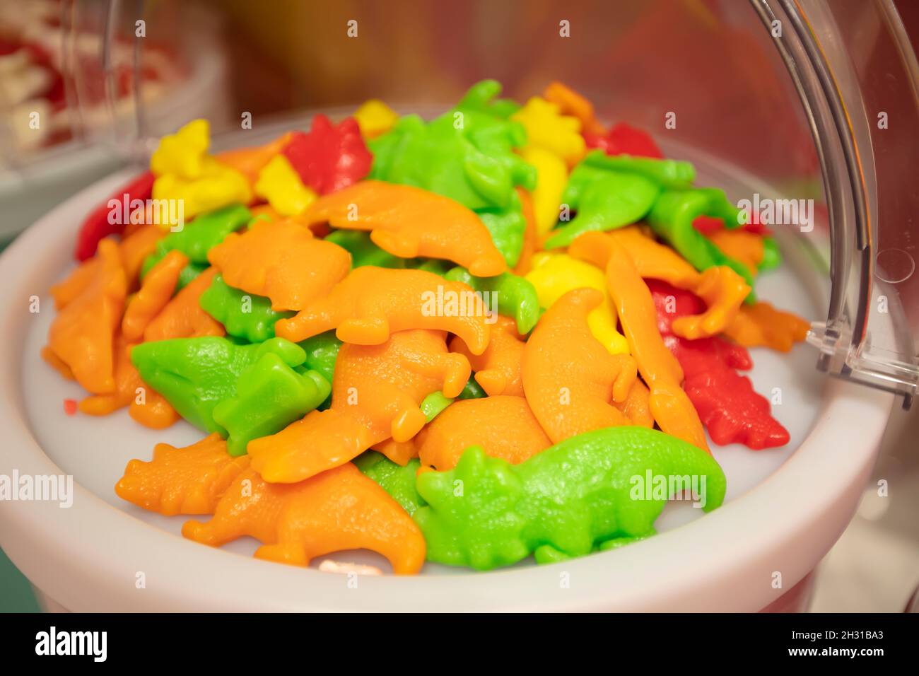 Jelly candies in containers in a store. Large selection of sweets in ...