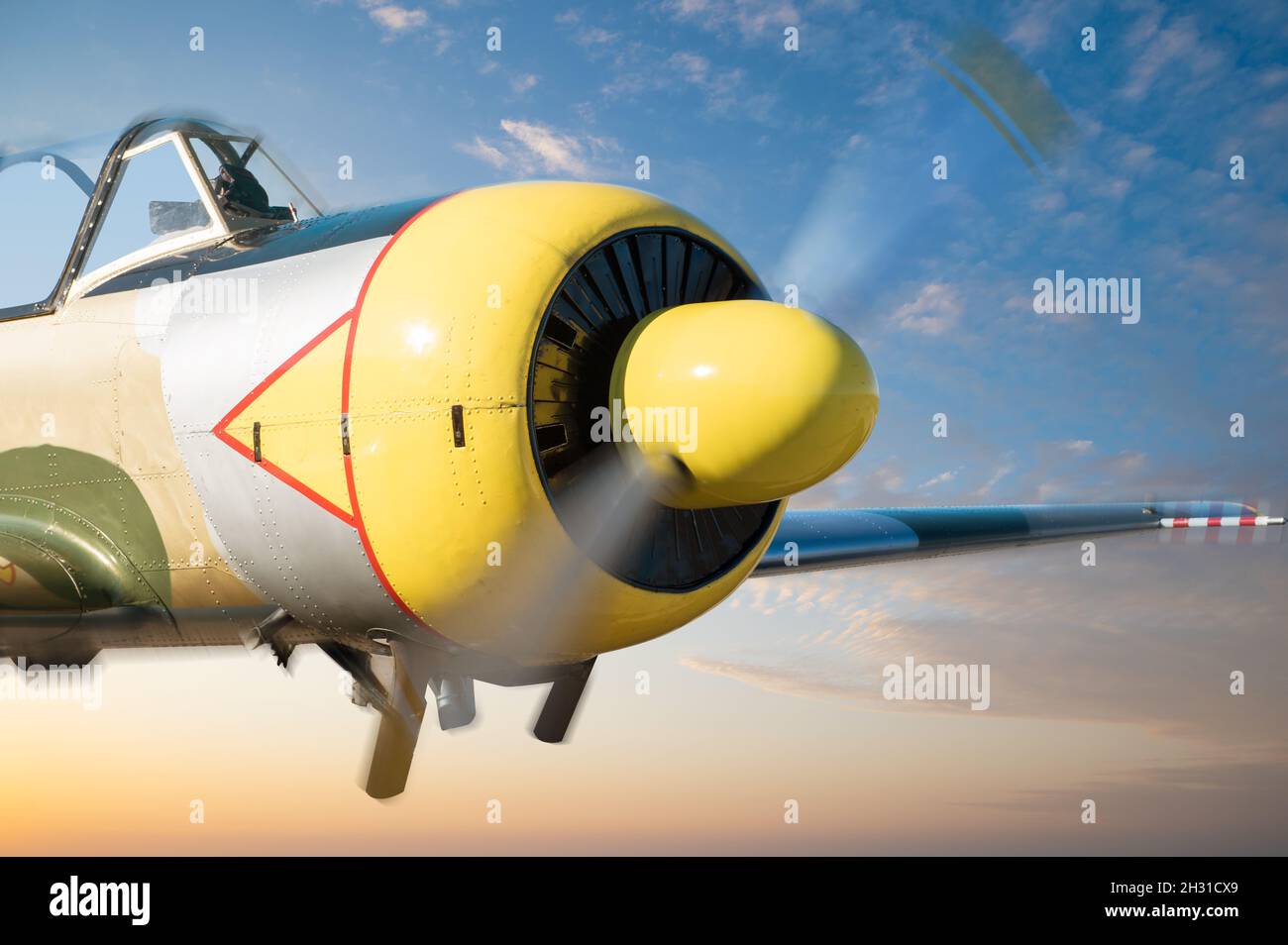 Small aircraft flying above in the blue sunset sky Stock Photo - Alamy