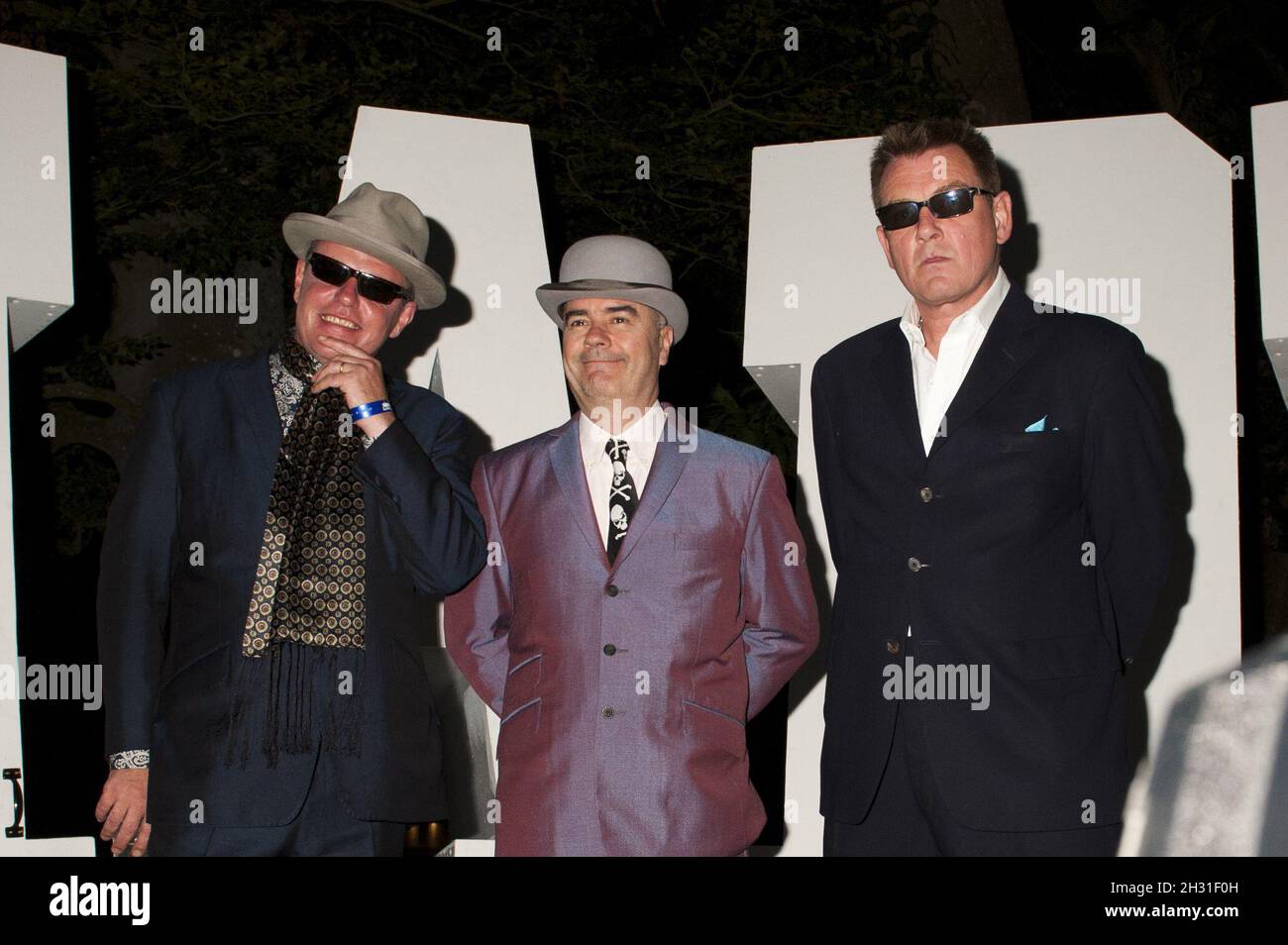 Suggs, Chrissy Boy and Chas Smash from Madness pose at Camp Bestival ...