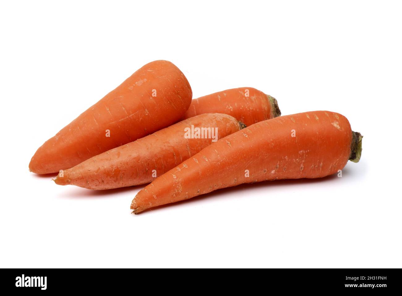 Five orange carrots hi-res stock photography and images - Alamy