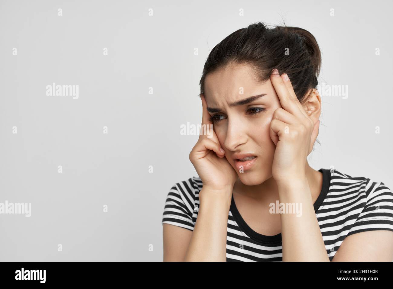 woman holding his head migraine depression health problems Stock Photo ...