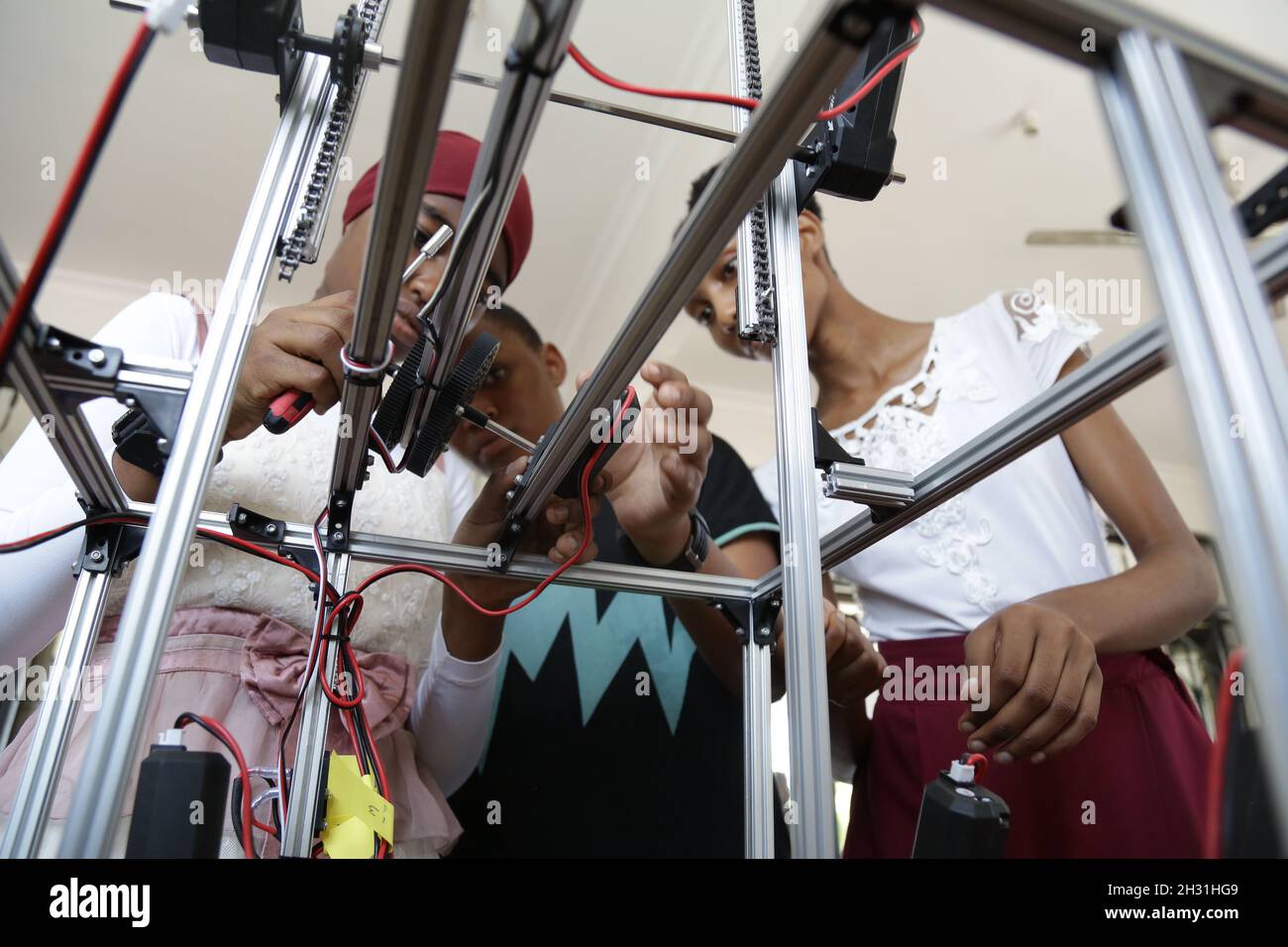 Dar Es Salaam. 23rd Oct, 2021. Girls work on a robot at Apps and Girls ...