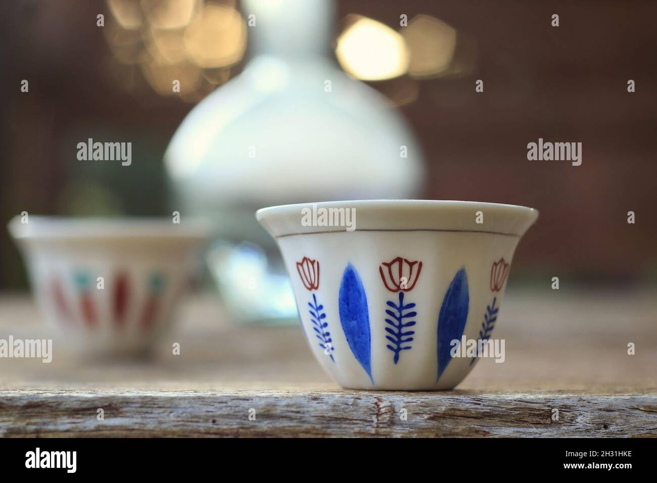 A traditional Lebanese chaffeh coffee cup with an ebrik in the ...