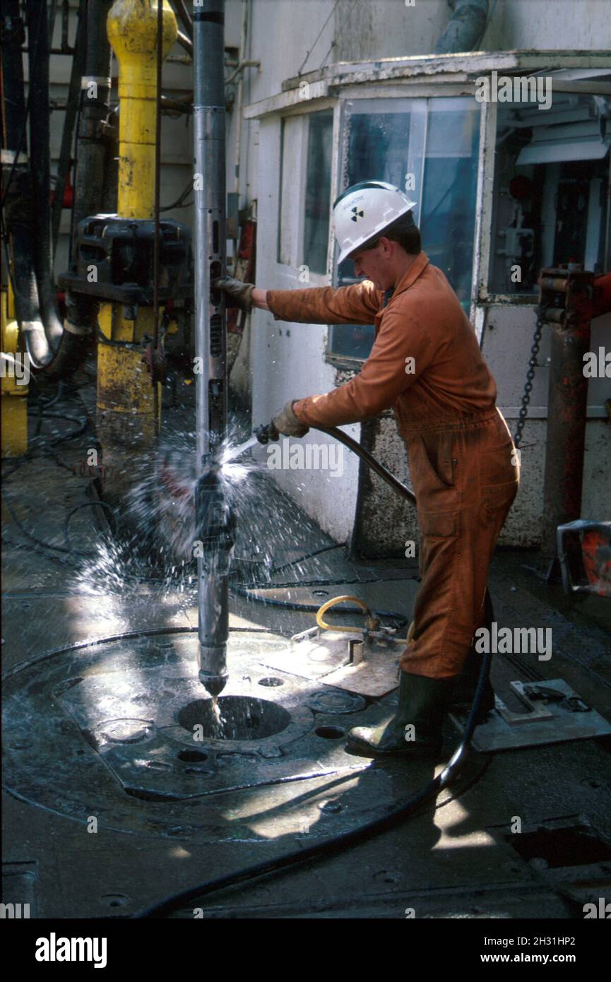 Wireline operator washing down logging tool, Offshore semi-submersible ...