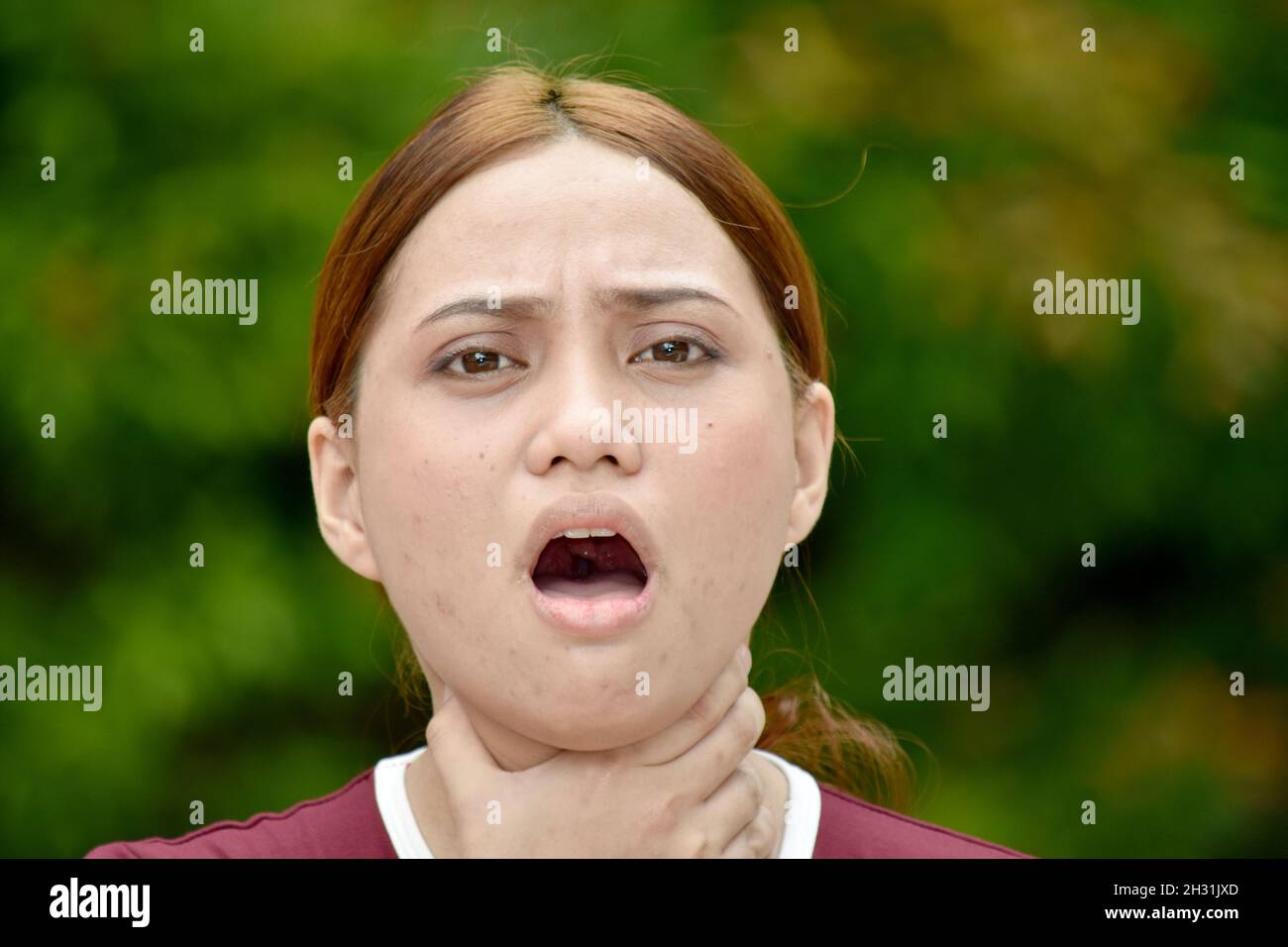 A Youthful Adult Female Choking Stock Photo - Alamy