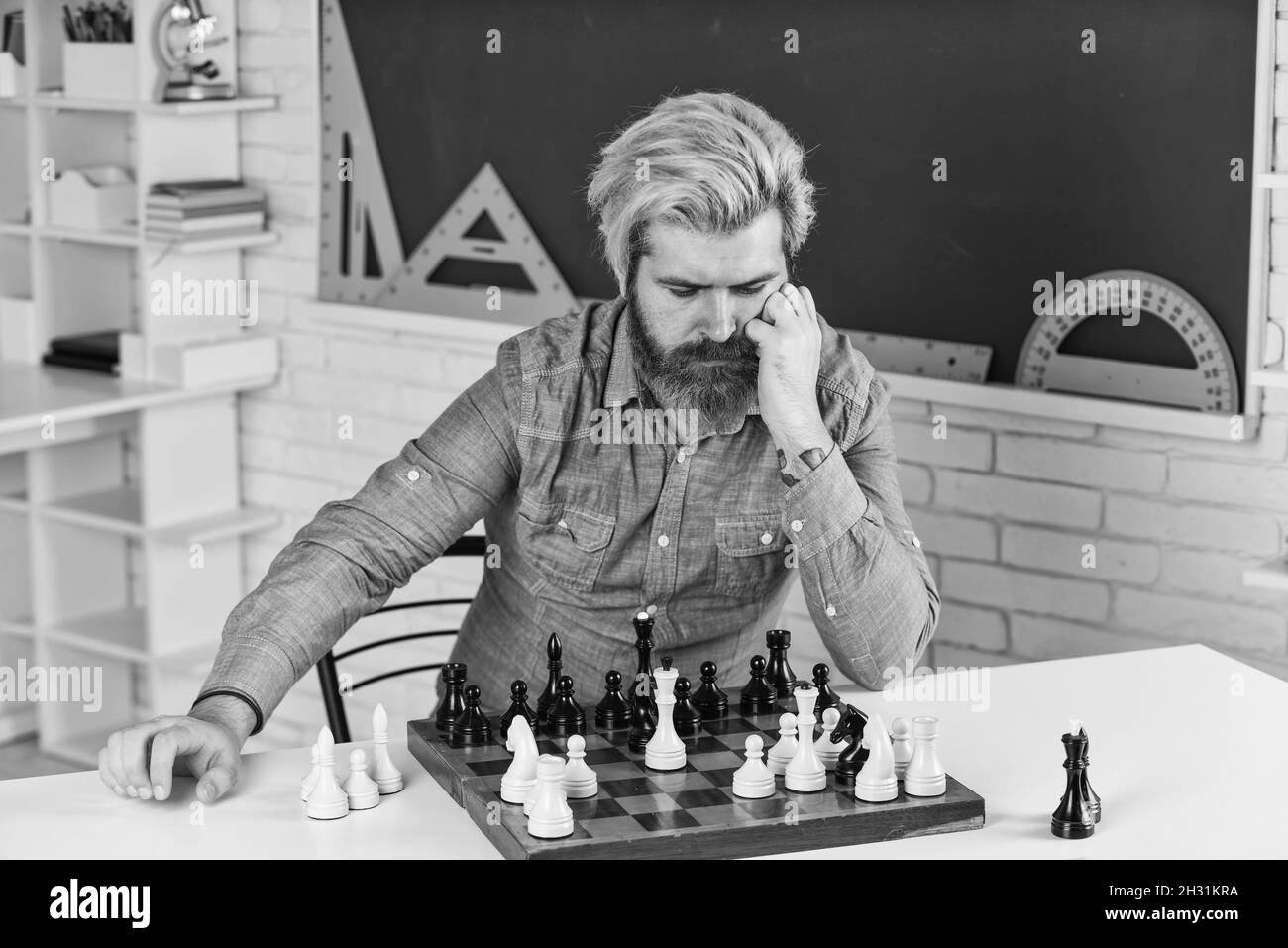 moving piece during tournament. moving pieces on chess board. man hold ...