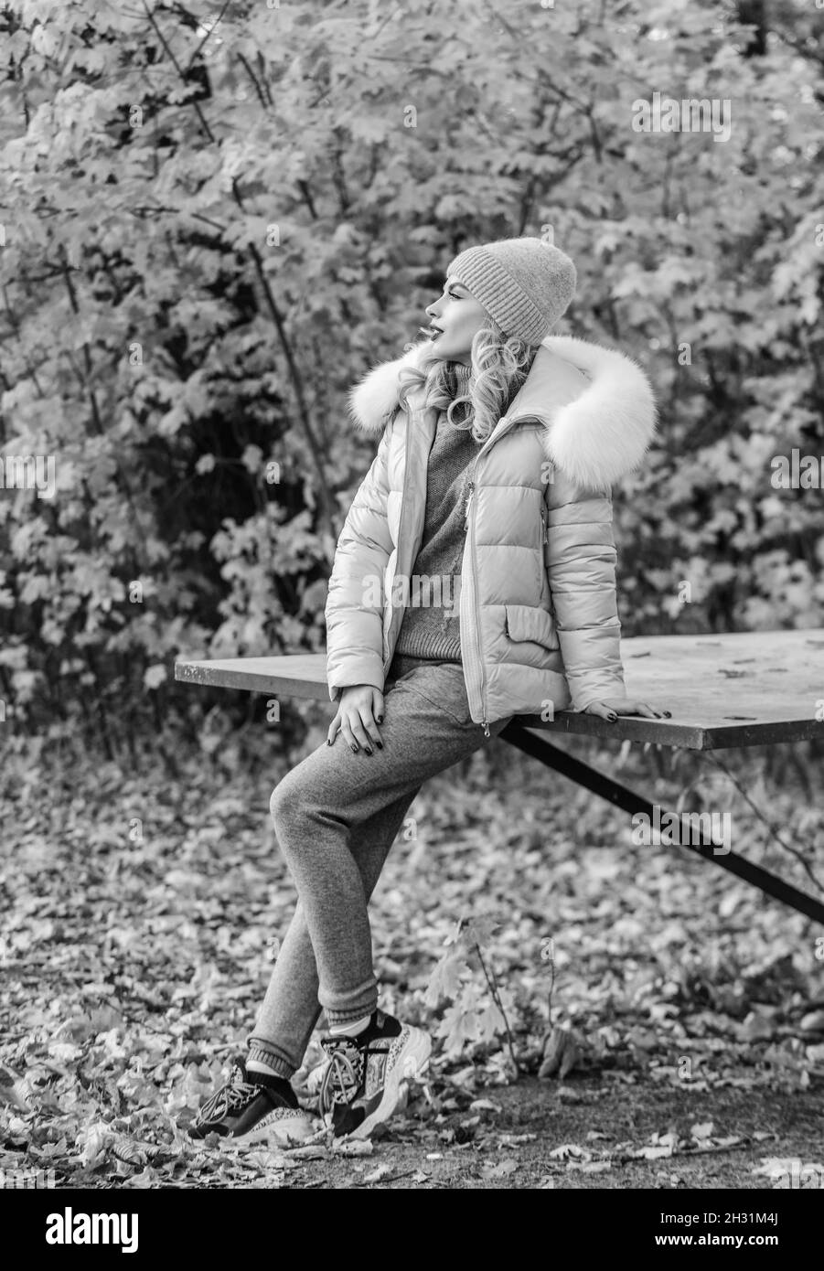Clothes for rest. Girl relaxing in nature wearing knitwear suit and ...