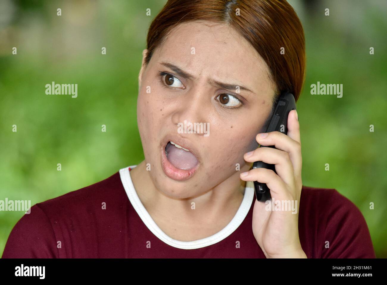 Unhappy using telephone hi-res stock photography and images - Alamy