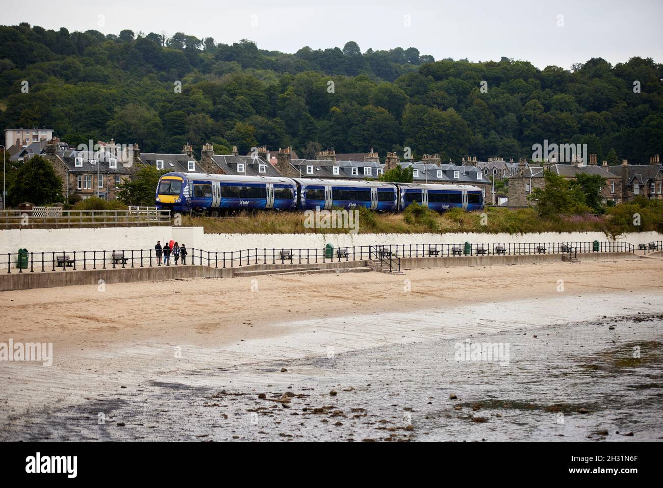 Burntisland, Fife, Scotland, a Scotrail trail traveling along the beach ...