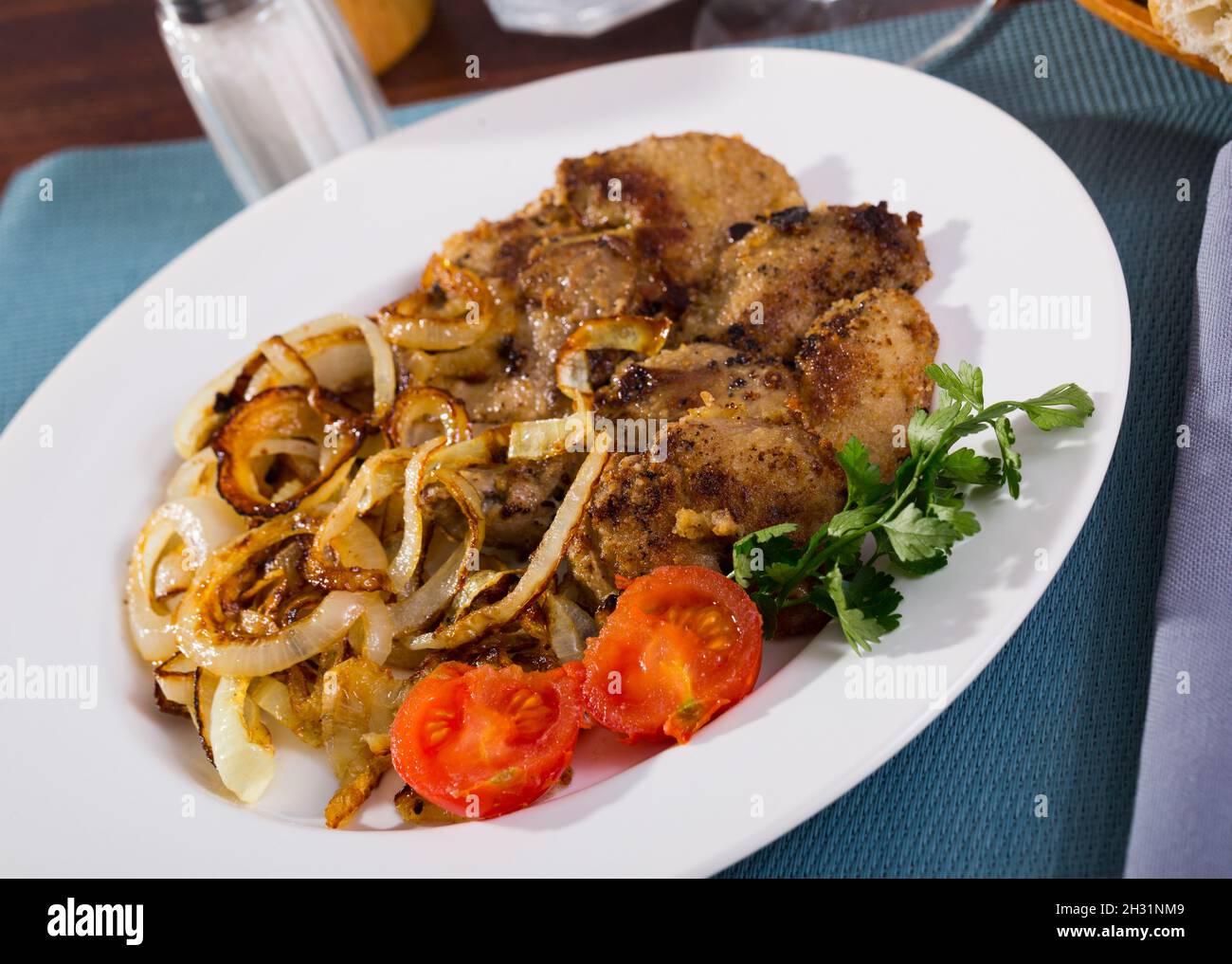 Fried rabbit liver with onion Stock Photo - Alamy