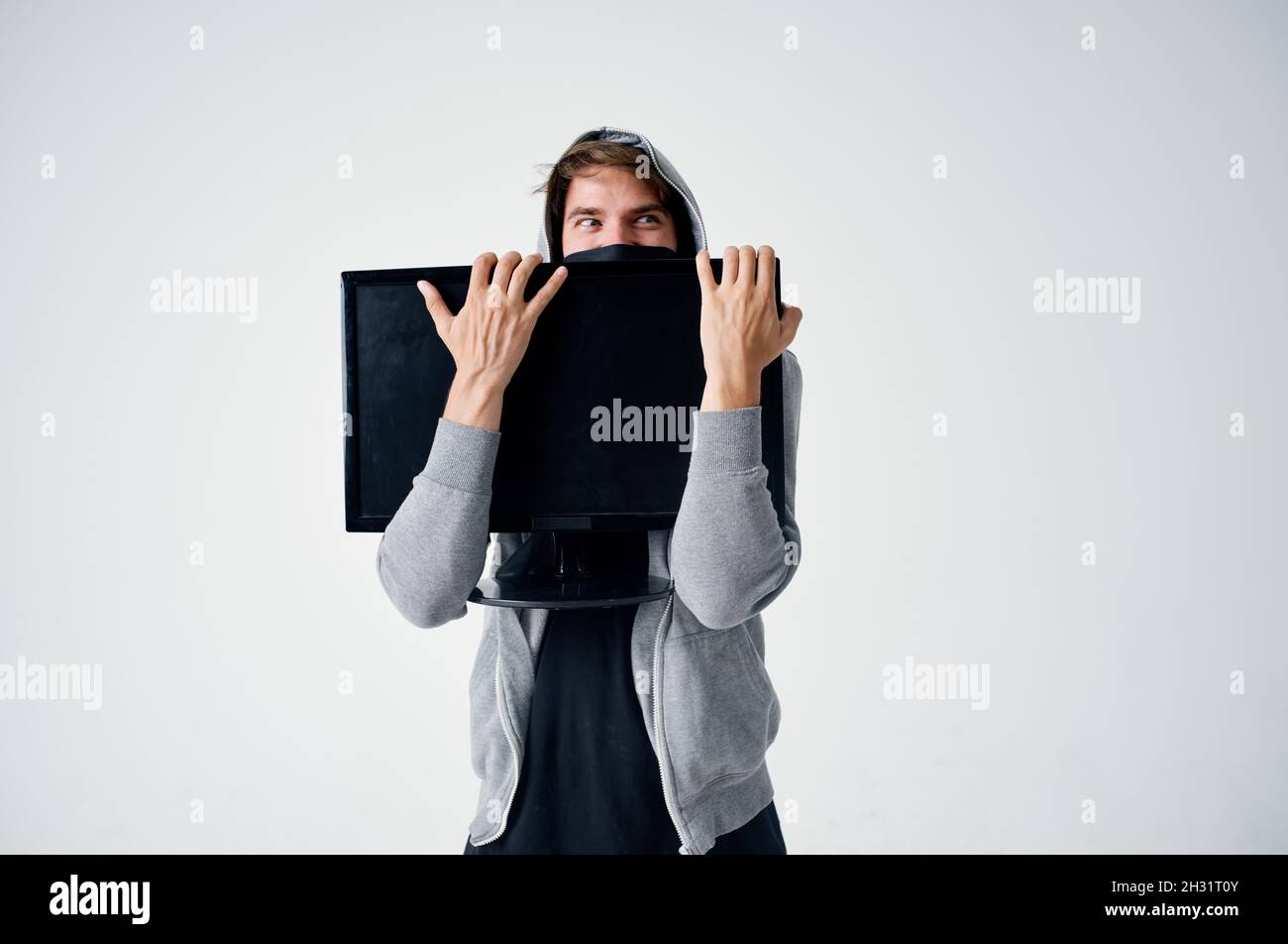 male thief stealth technique robbery safety hooligan light background ...