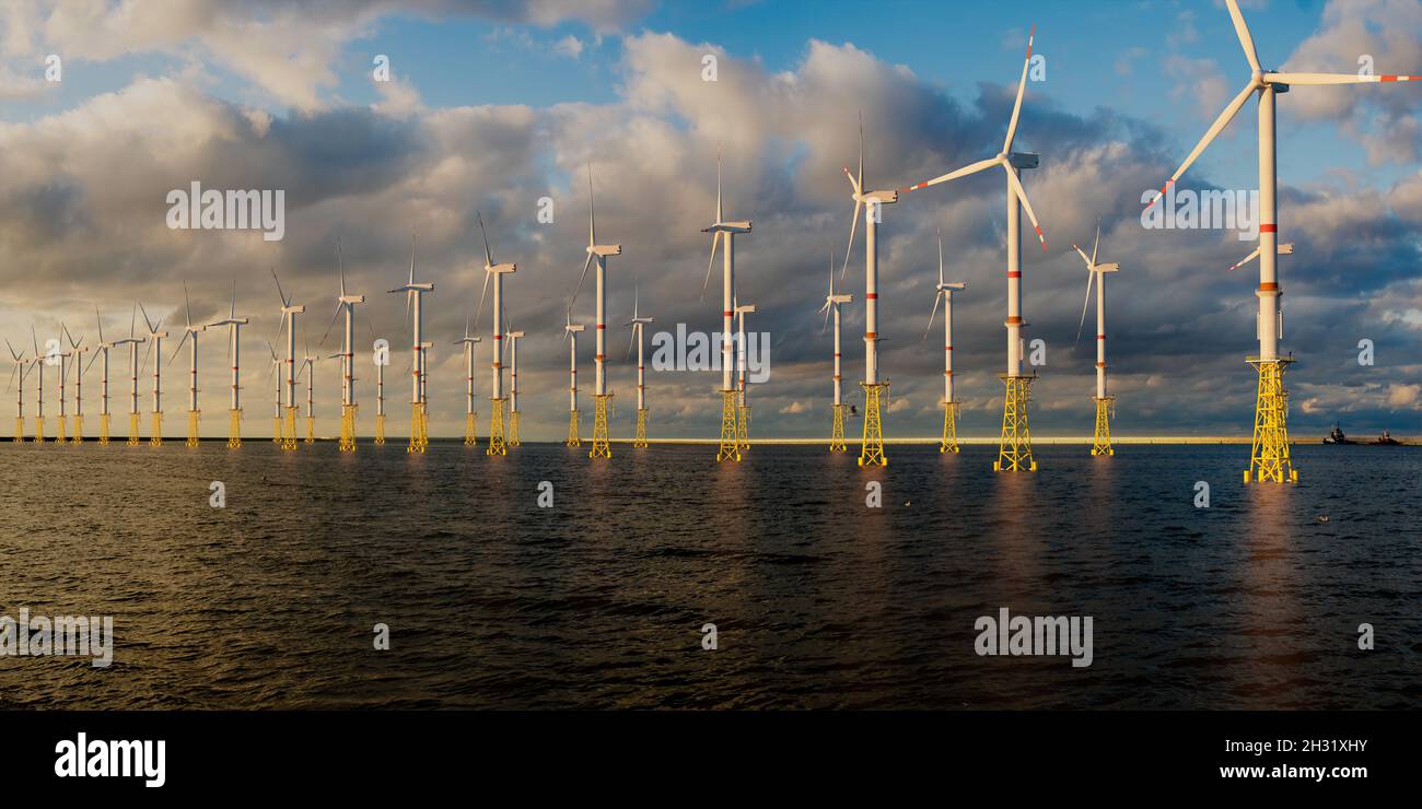 Offshore wind farm at beautiful, dramatic sunset Stock Photo - Alamy