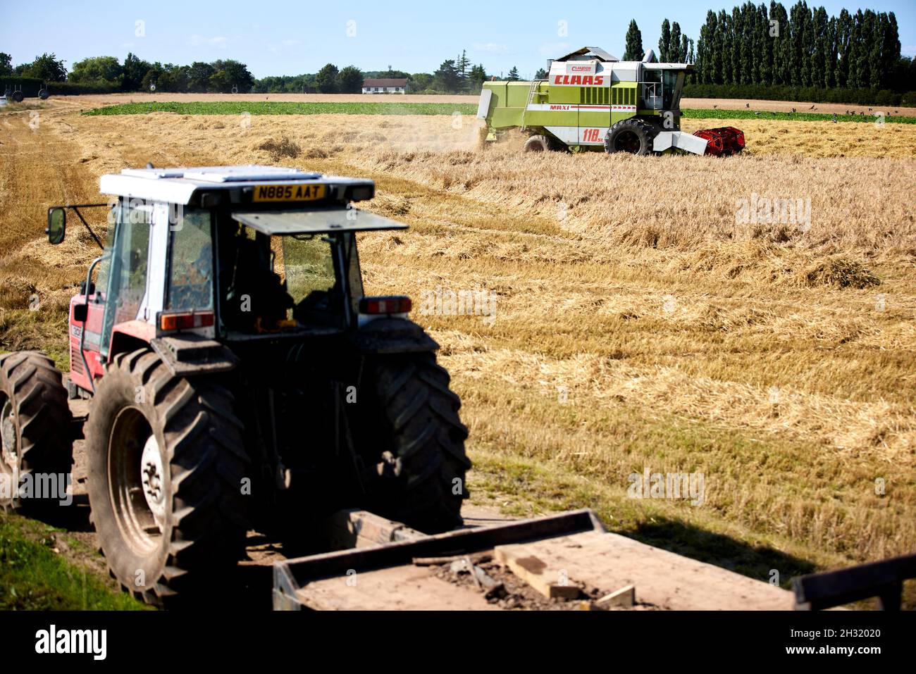 Combine harvester working a rice field hi-res stock photography and ...