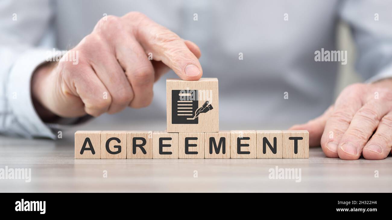 Wooden blocks with symbol of agreement concept Stock Photo - Alamy