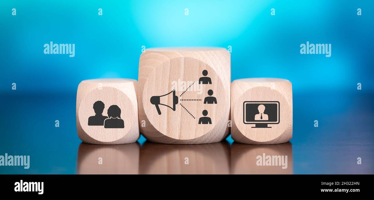Wooden blocks with symbol of public relations concept on blue ...