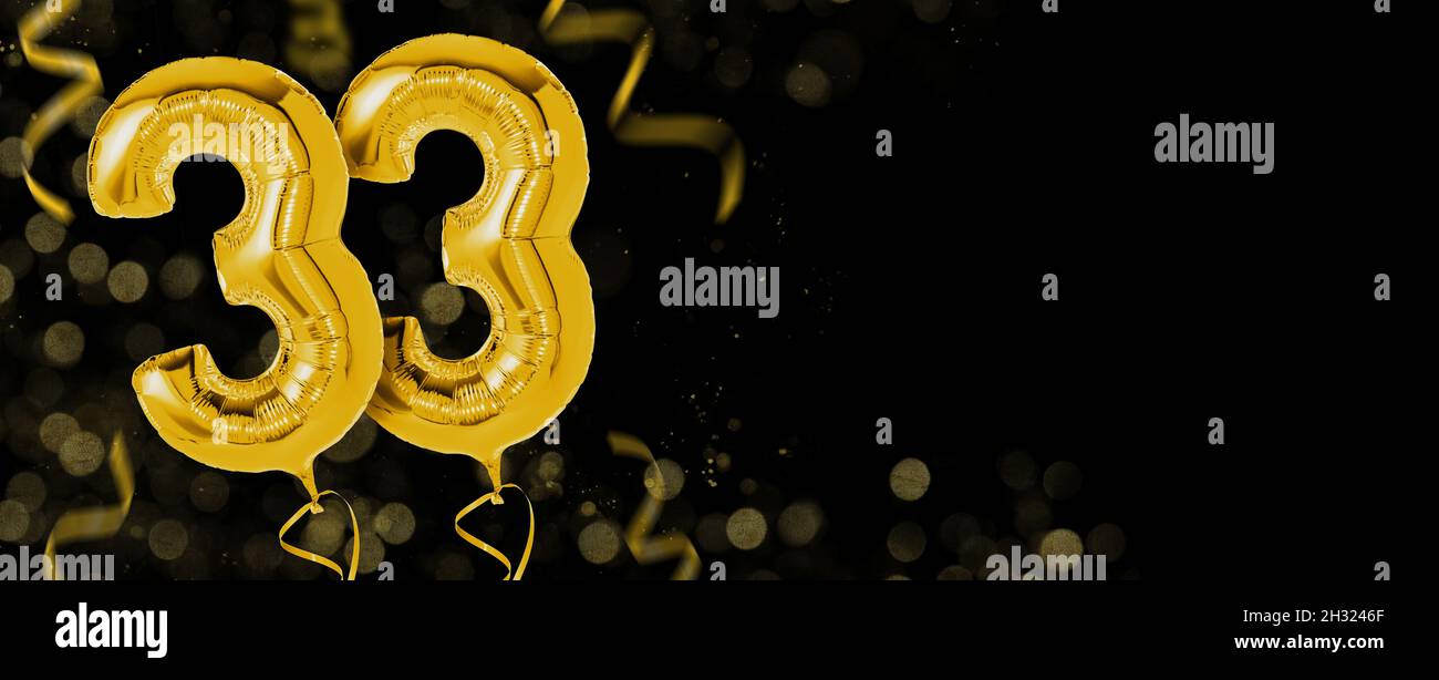 Golden balloons with copy space - Number 33 Stock Photo - Alamy