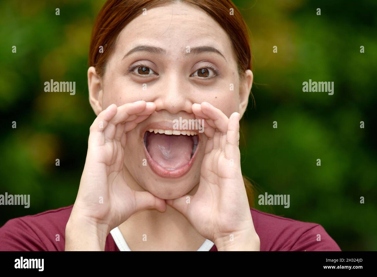 Young Filipina Woman Shouting Wearing Tshirt Stock Photo - Alamy
