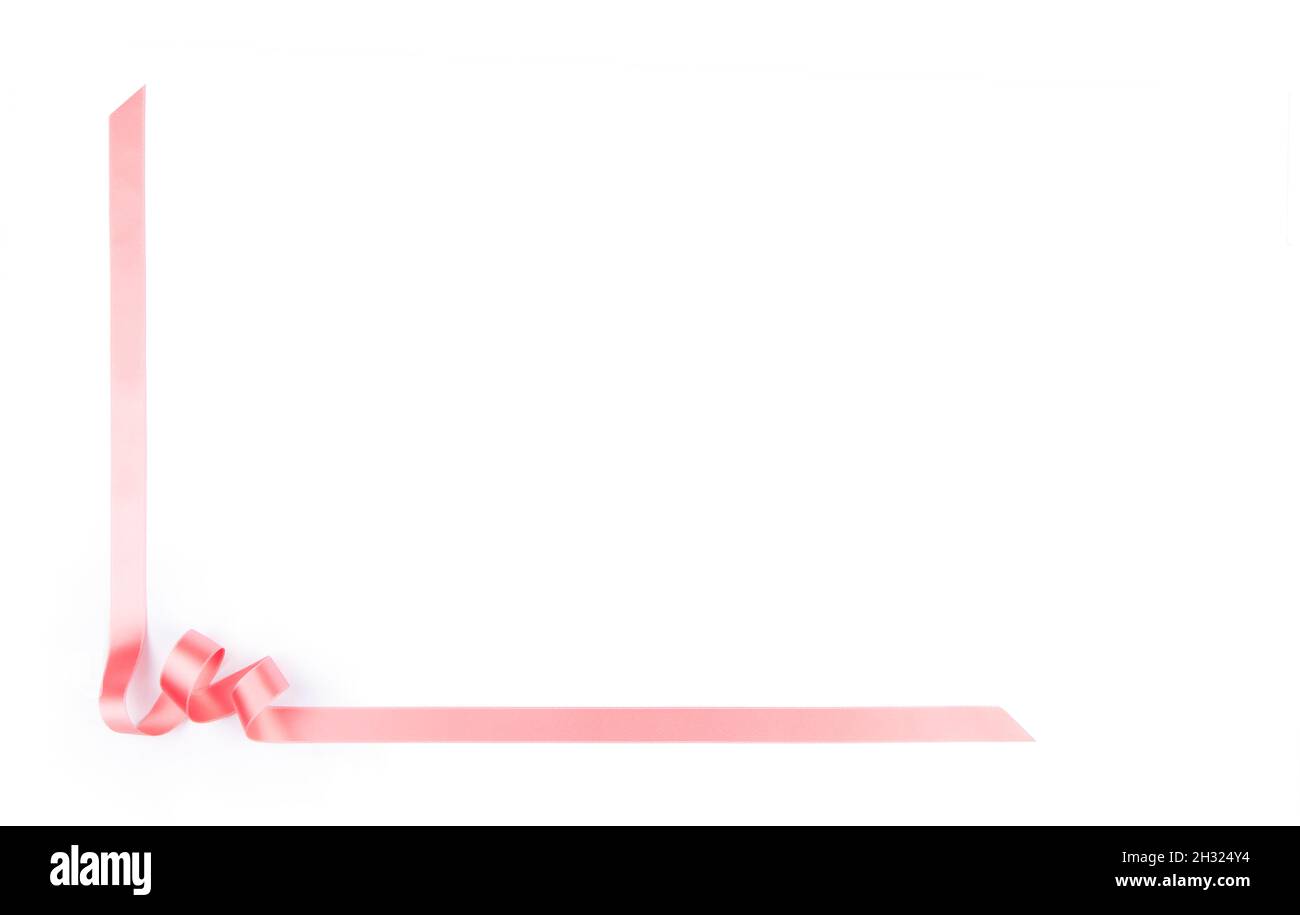 Pink streamer ribbon on white background Stock Photo - Alamy