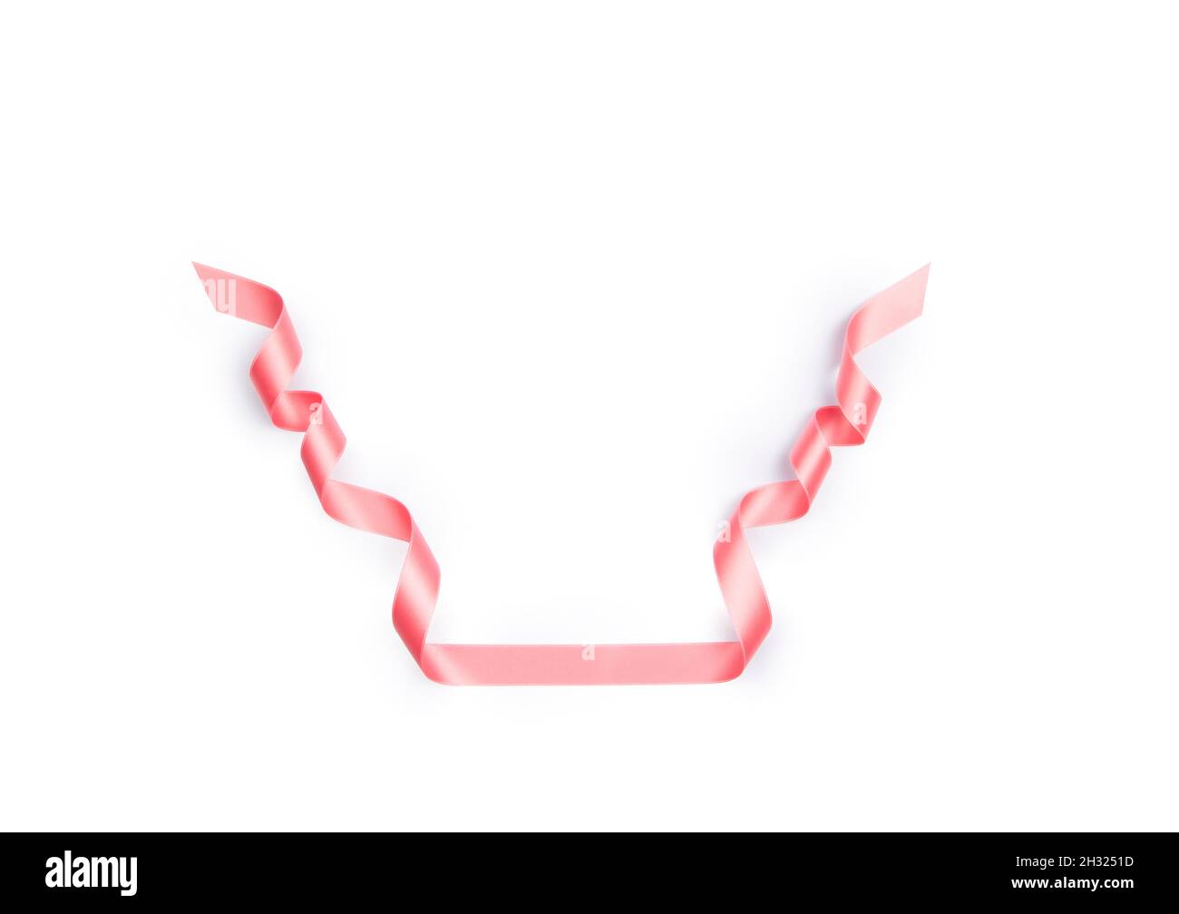Pink streamer ribbon on white background Stock Photo - Alamy
