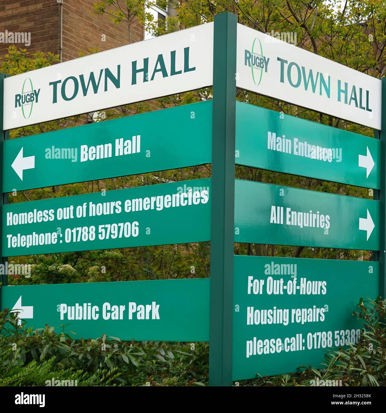 Corner signpost outside Rugby Town Hall building arrows point to ...