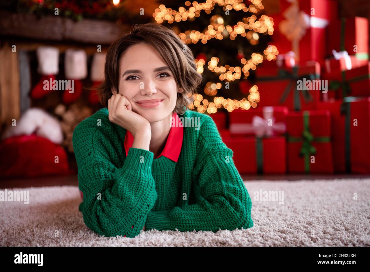 Photo of charming cute young lady wear green pullover smiling lying ...