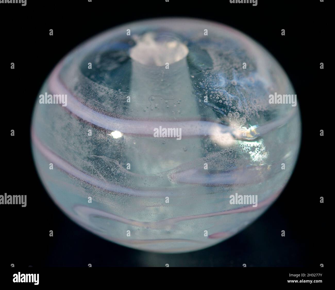 Handmade white glass bead Stock Photo - Alamy