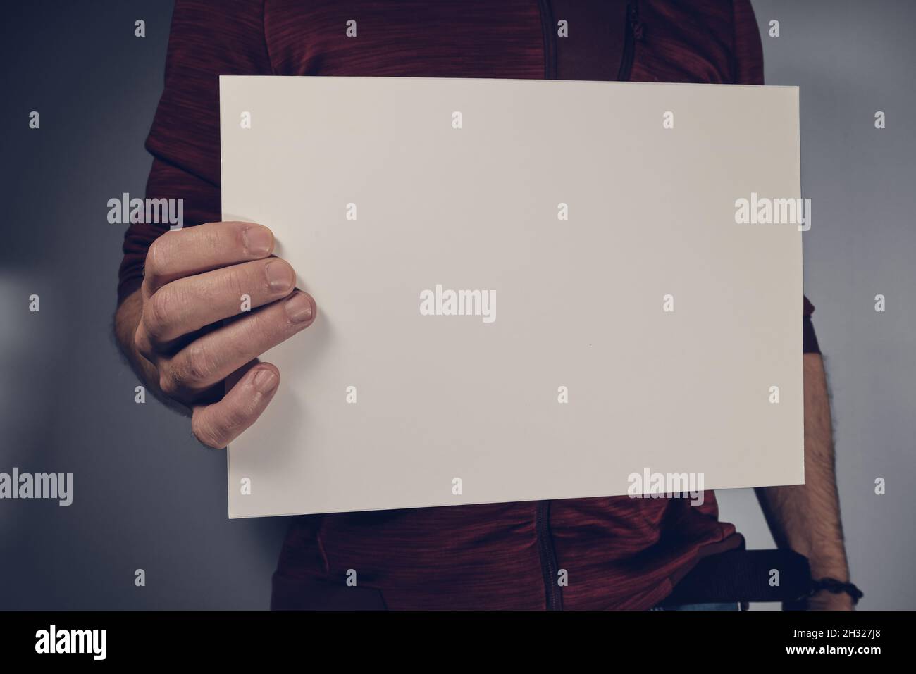 Person holding a4 paper hi-res stock photography and images - Alamy