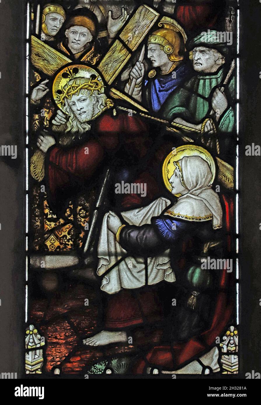 A stained glass window by the Kempe Studio. depicting Jesus carrying ...