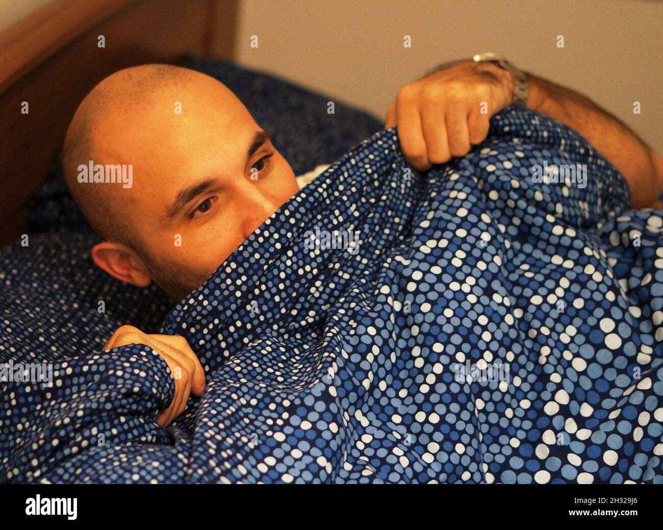 Scared Man in the bed Stock Photo - Alamy