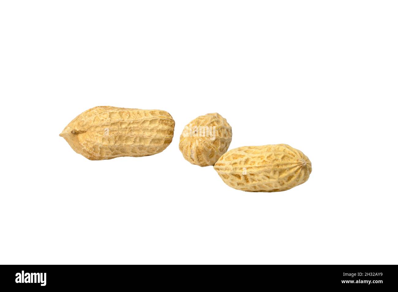 Isolated on a white background, a large peanut set. Shelled and ...