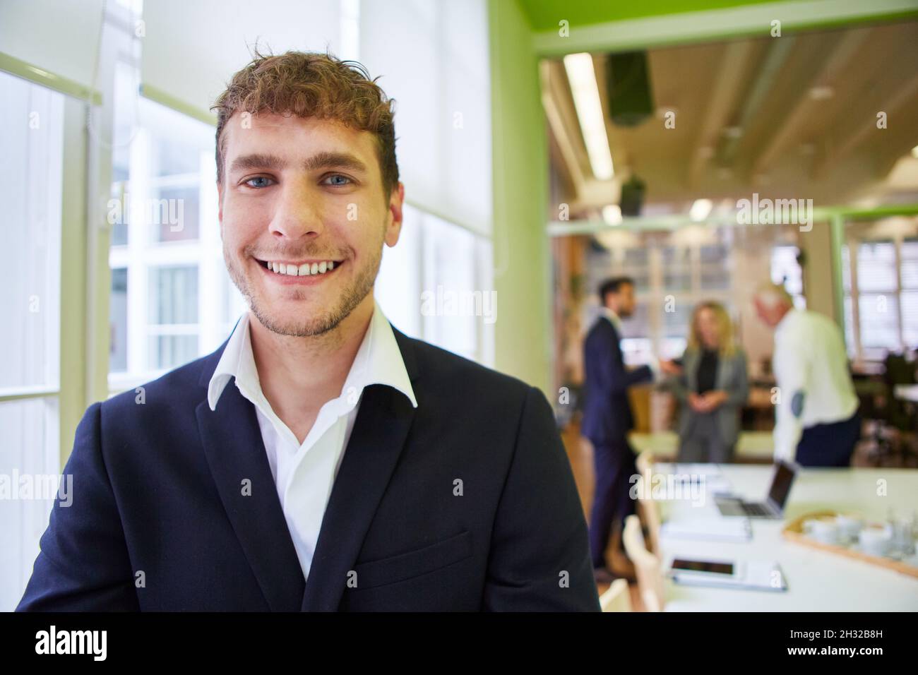 Young man as a successful start-up founder after a meeting in the ...