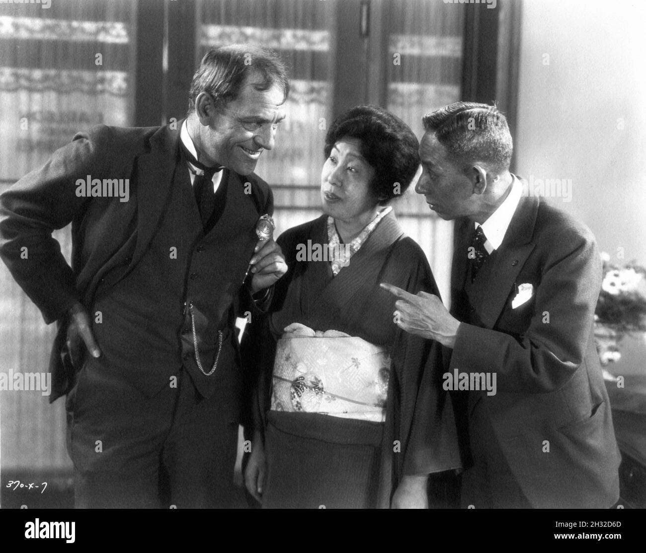 LON CHANEY on set candid with 2 Unidentified Japanese Set Visitors ...