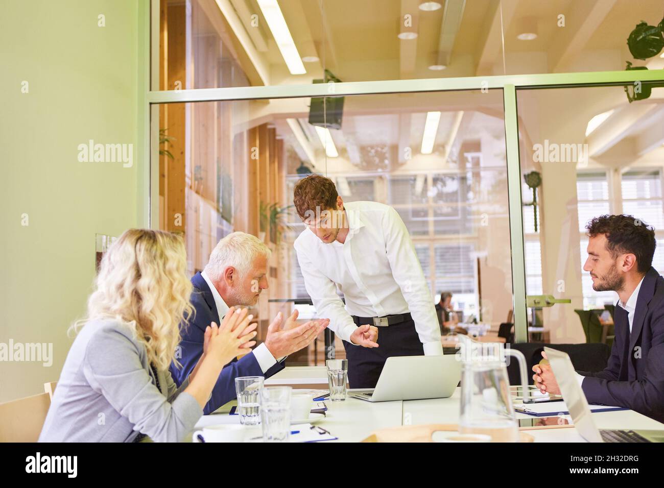 Business team in a computer workshop or in a strategy meeting in the ...