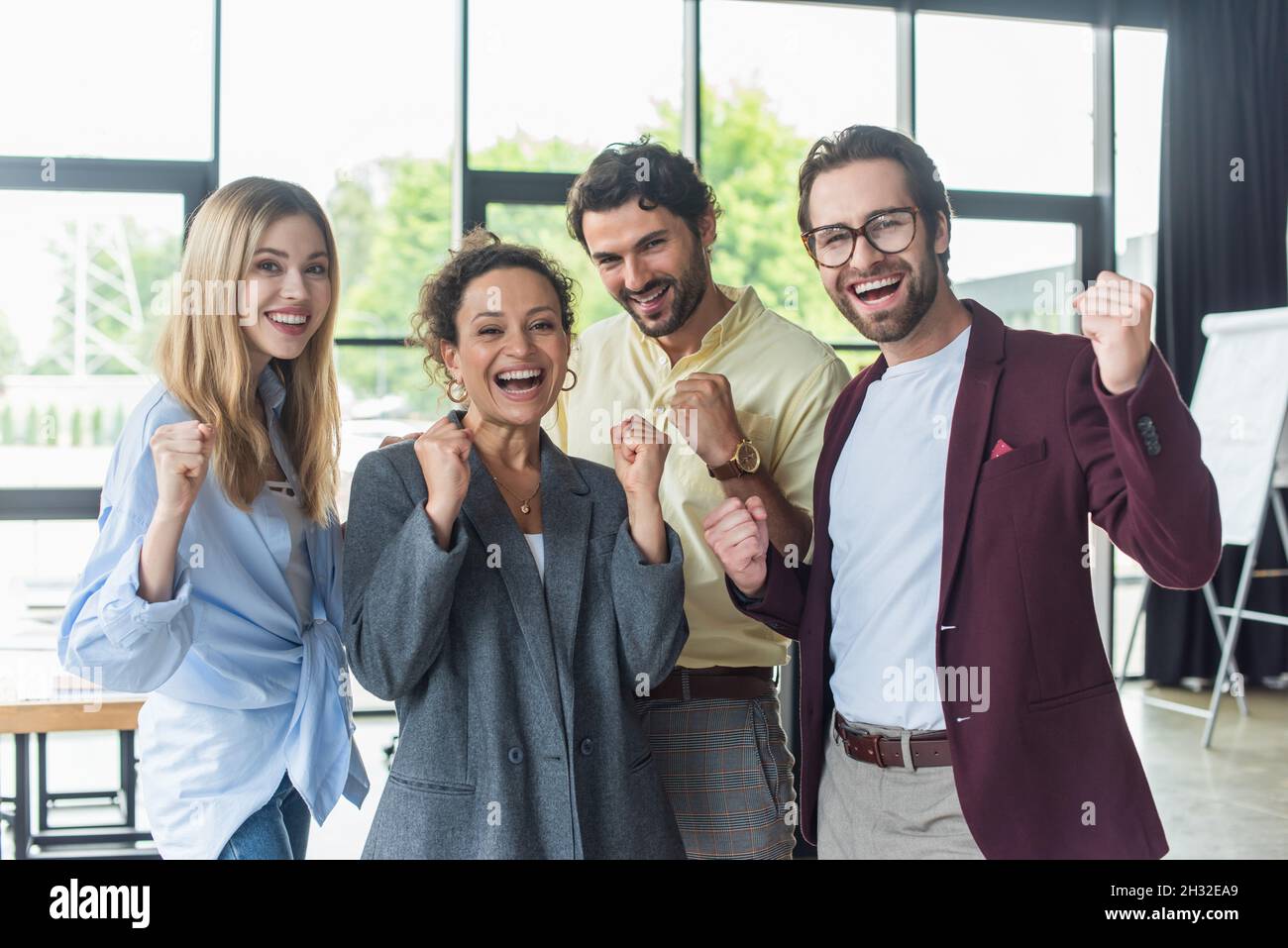 Excited business team celebrating work hi-res stock photography and ...