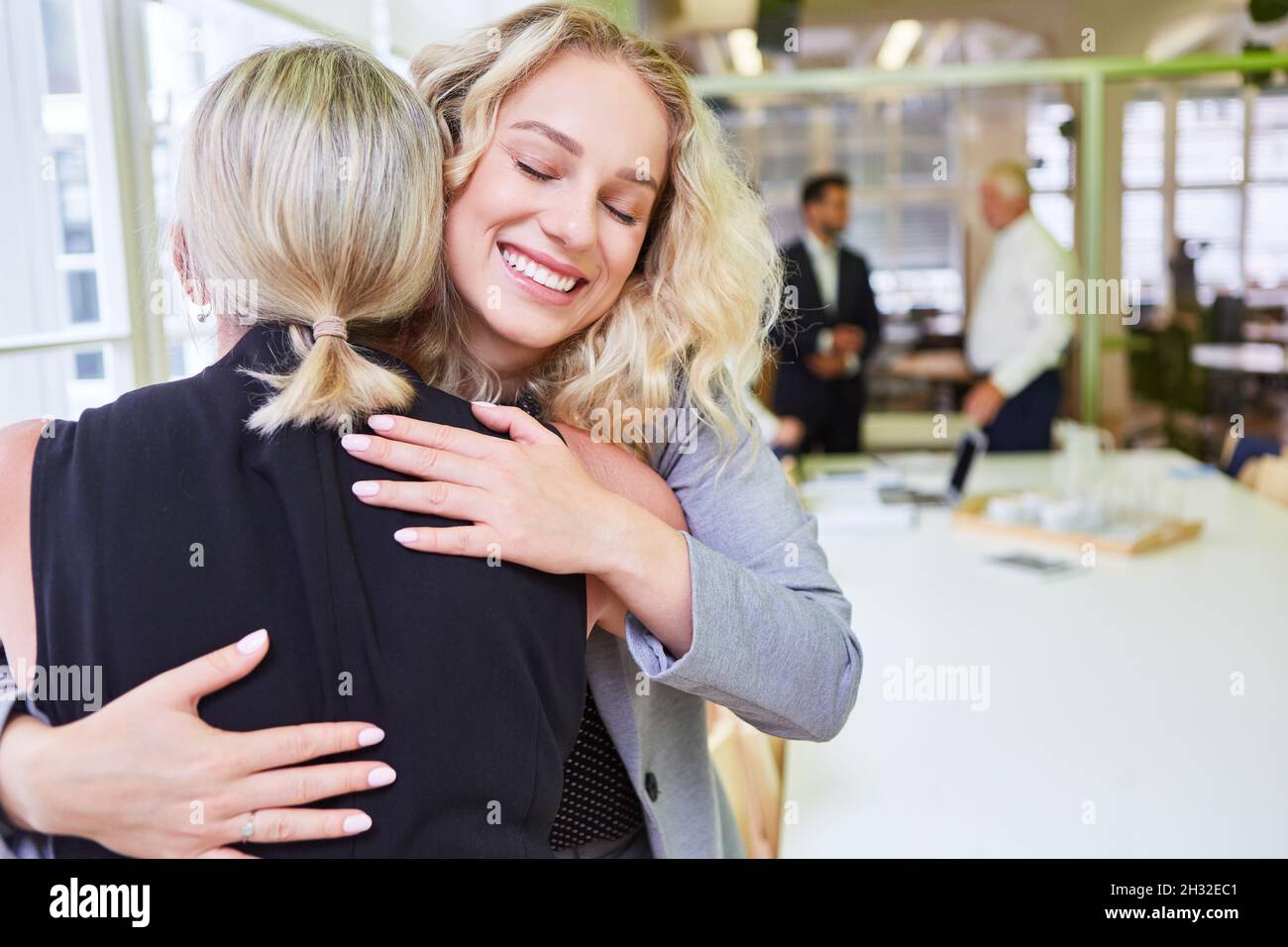 Women embrace hi-res stock photography and images - Alamy