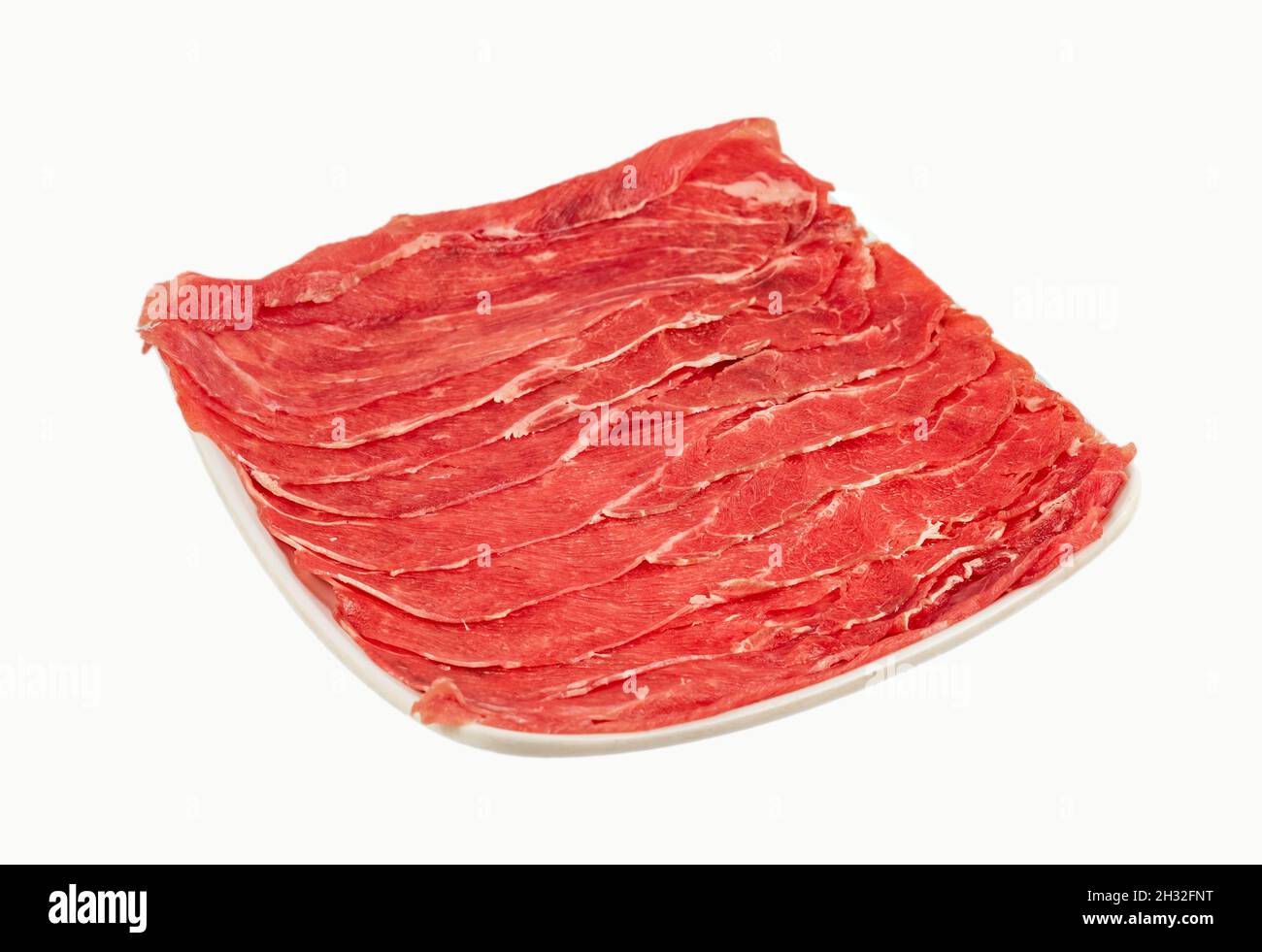 Sliced raw beef dish Cut Out Stock Images & Pictures - Alamy