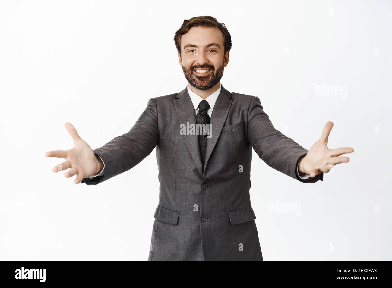 Image of businessman welcomes customers to store. Salesman extends ...
