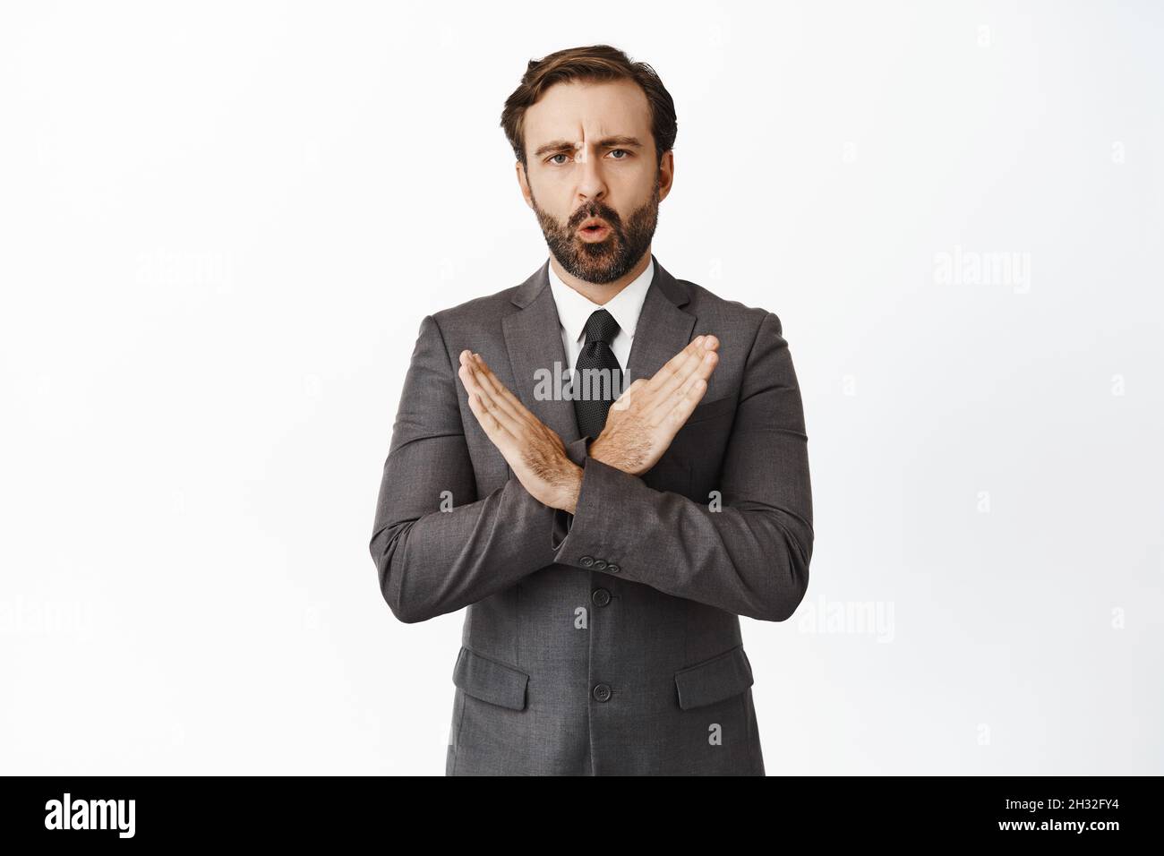 Stop, enough. Concerned corporate man showing cross, no gesture, deny ...