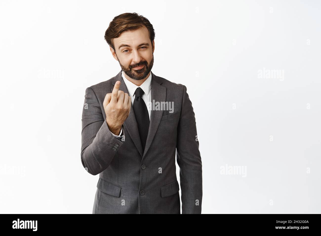 Come here. Smiling handsome businessman in suit inviting to approach ...