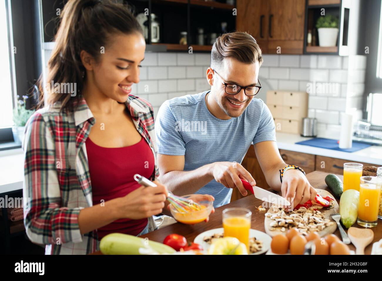People Cooking Food In The Kitchen