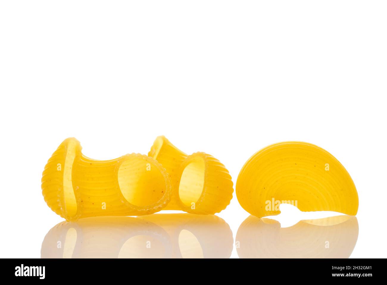 Bright yellow pasta, close-up, isolated on white Stock Photo - Alamy
