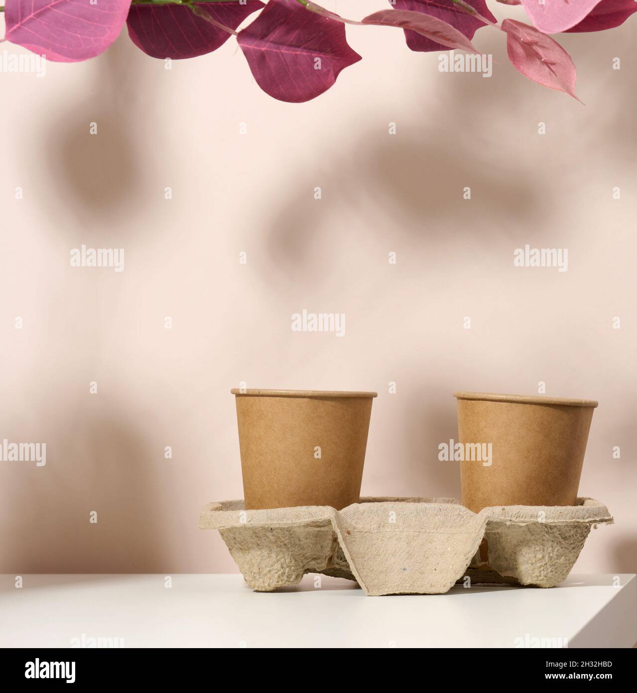 paper cardboard brown cups for coffee and tea, beige background. Eco ...