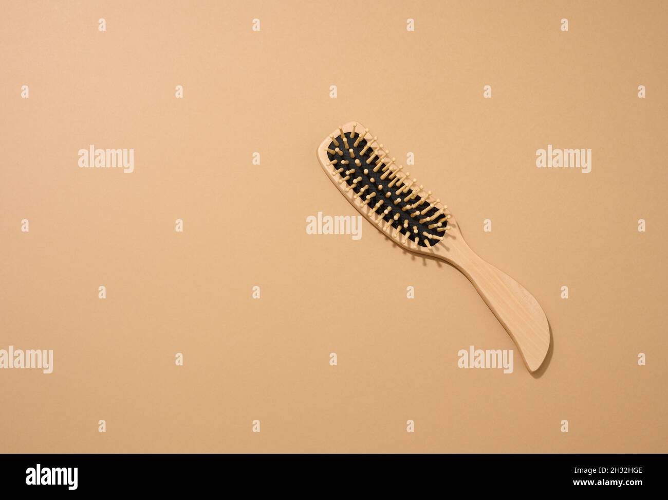 wooden hair comb on brown background, zero waste. Top view Stock Photo ...