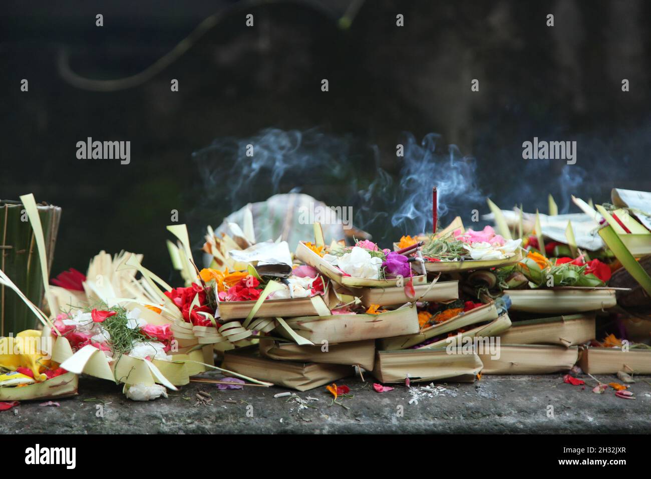 Traditional balinese offerings to gods in Bali with flowers, fruits and ...