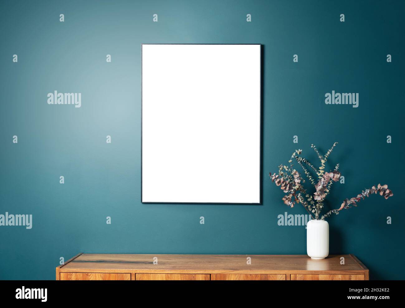 Blank picture frame mockup on green wall. Emerald living room design ...