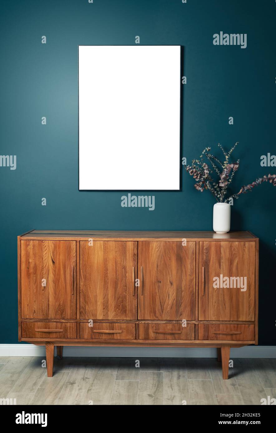 Blank picture frame mockup on green wall. Emerald living room design ...